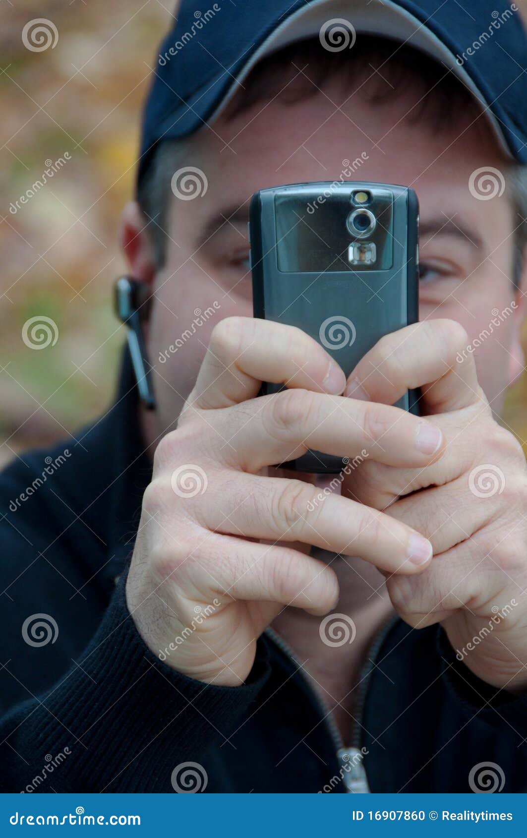 Man Pointing Smartphone Camera Stock Photo - Image of bluetooth, jabra ...