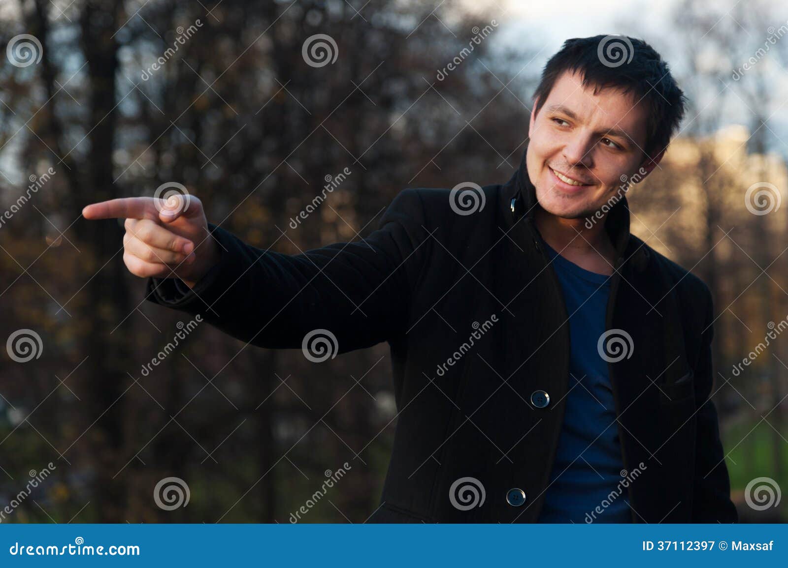 Man Pointing at Something in the Park Stock Image - Image of person ...