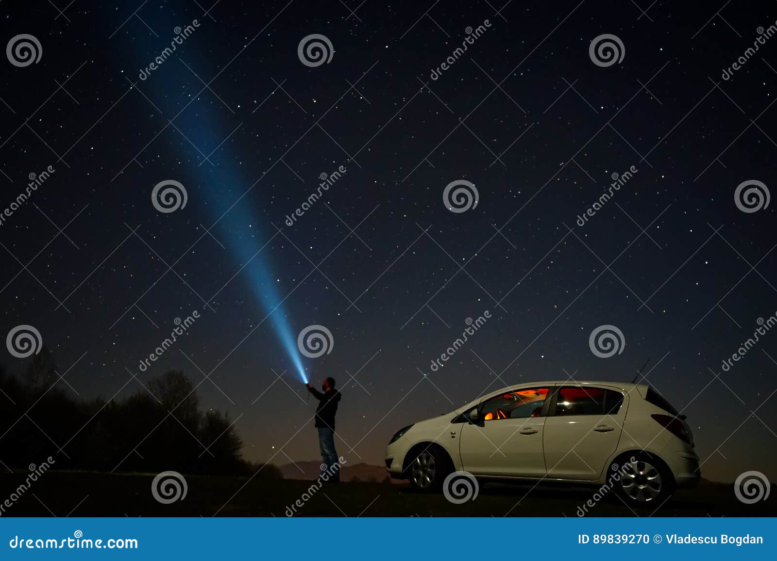 Man pointing at stars stock photo. Image of lighting - 89839270