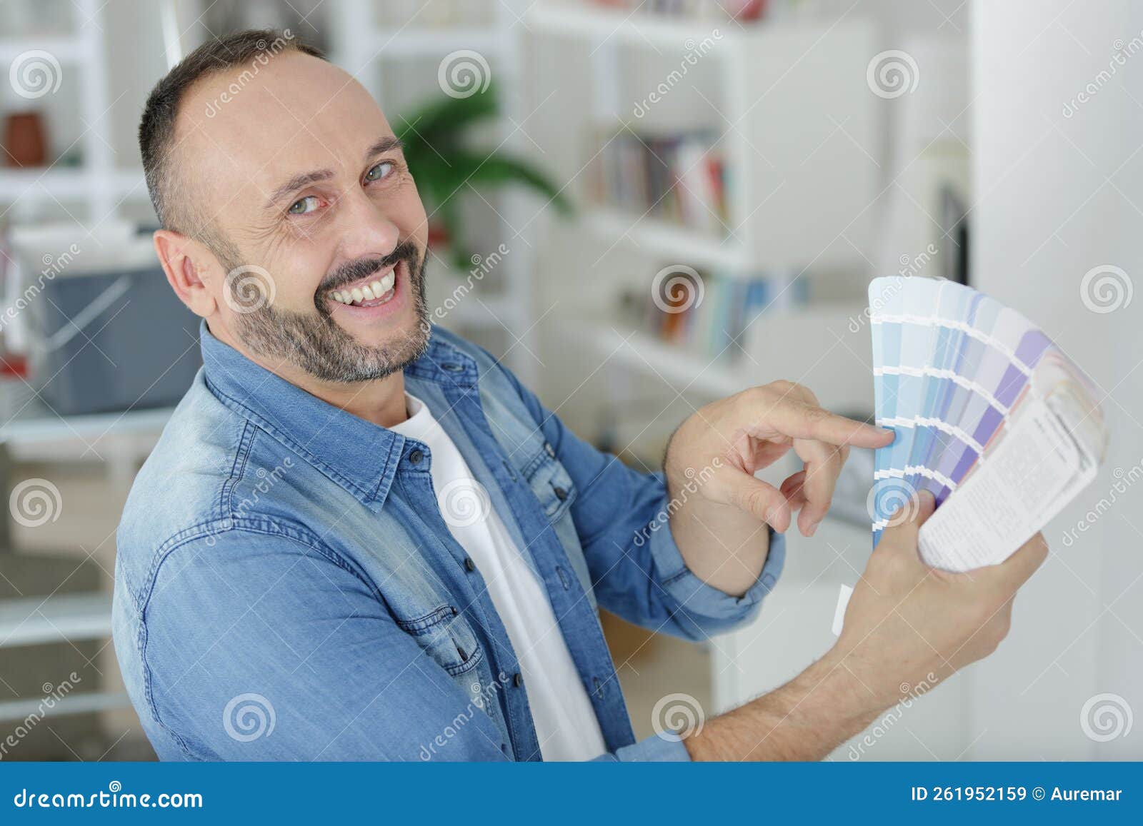 Man Pointing Towards Paint Colour Sample and Laughing Stock Image ...