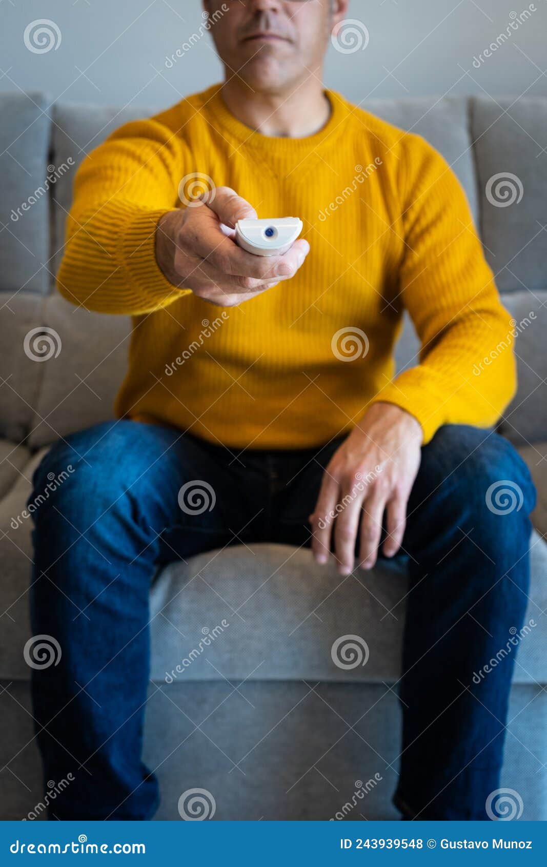 Man Pointing with Tv`s Remote Control Towards Camera from Sofa Stock ...