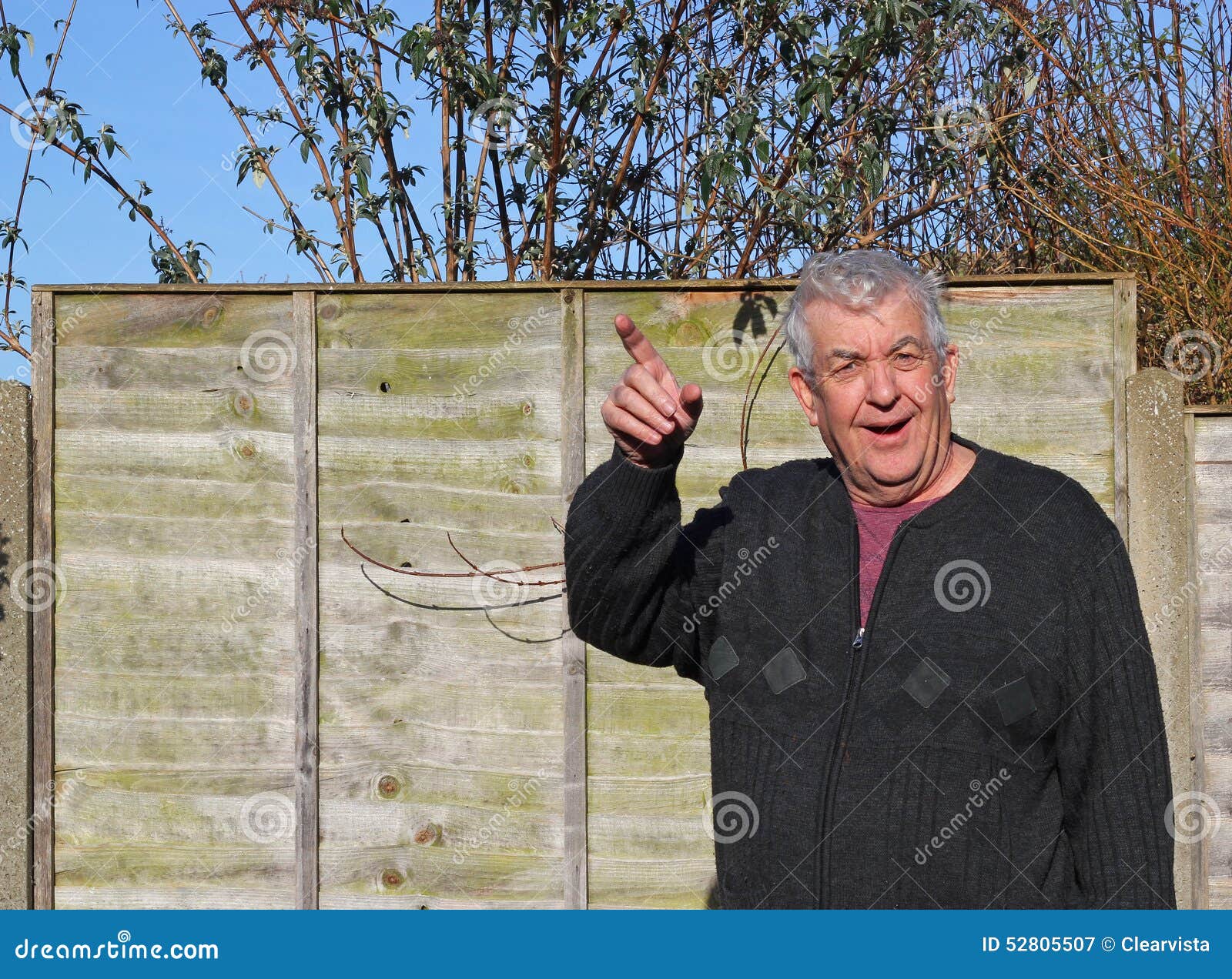 Man Pointing Upwards and Looking Towards Camera. Stock Image - Image of ... Man Pointing Upwards and Looking Towards Camera. Stock Image - Image of ...
