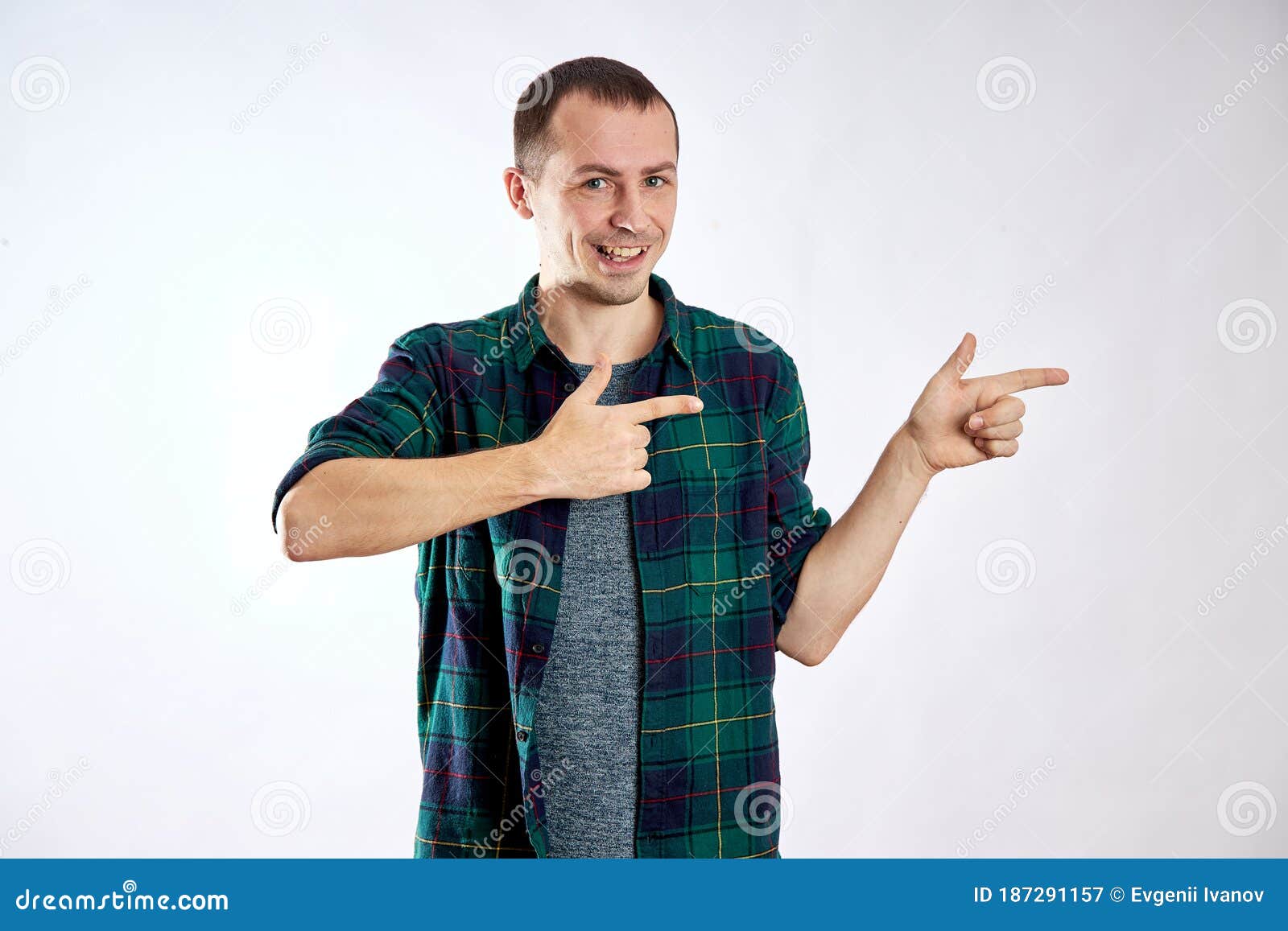 Man Points His Fingers To the Left, Makes Gestures with His Hands and ...