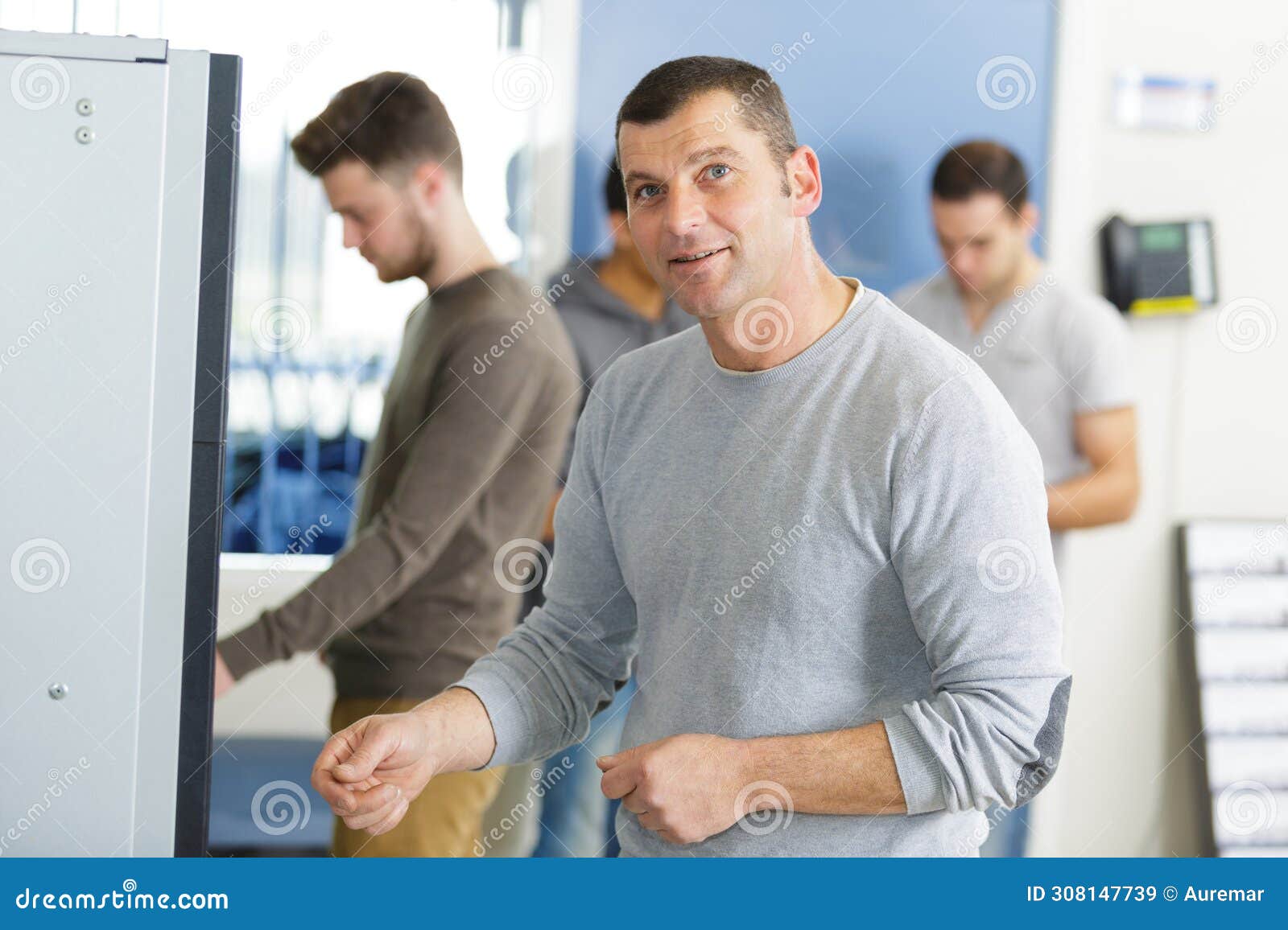 Man Poised To Put Coin into Vending Machine Stock Image - Image of ...