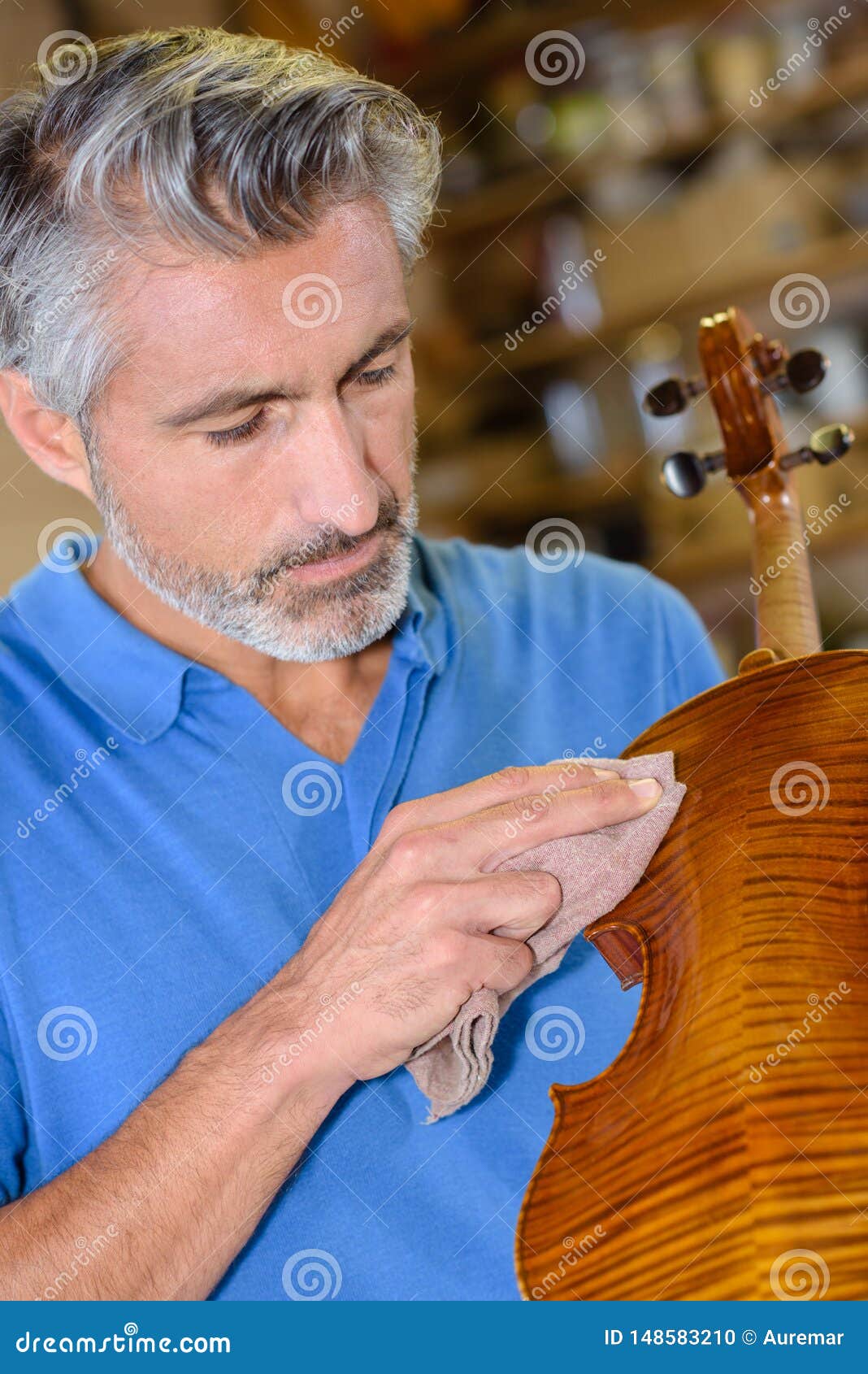 Man Polishing String Instrument Stock Photo - Image of fabricator ...
