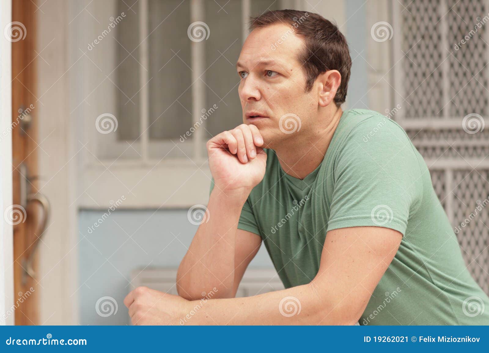 Man pondering on the ledge stock image. Image of outdoors - 19262021
