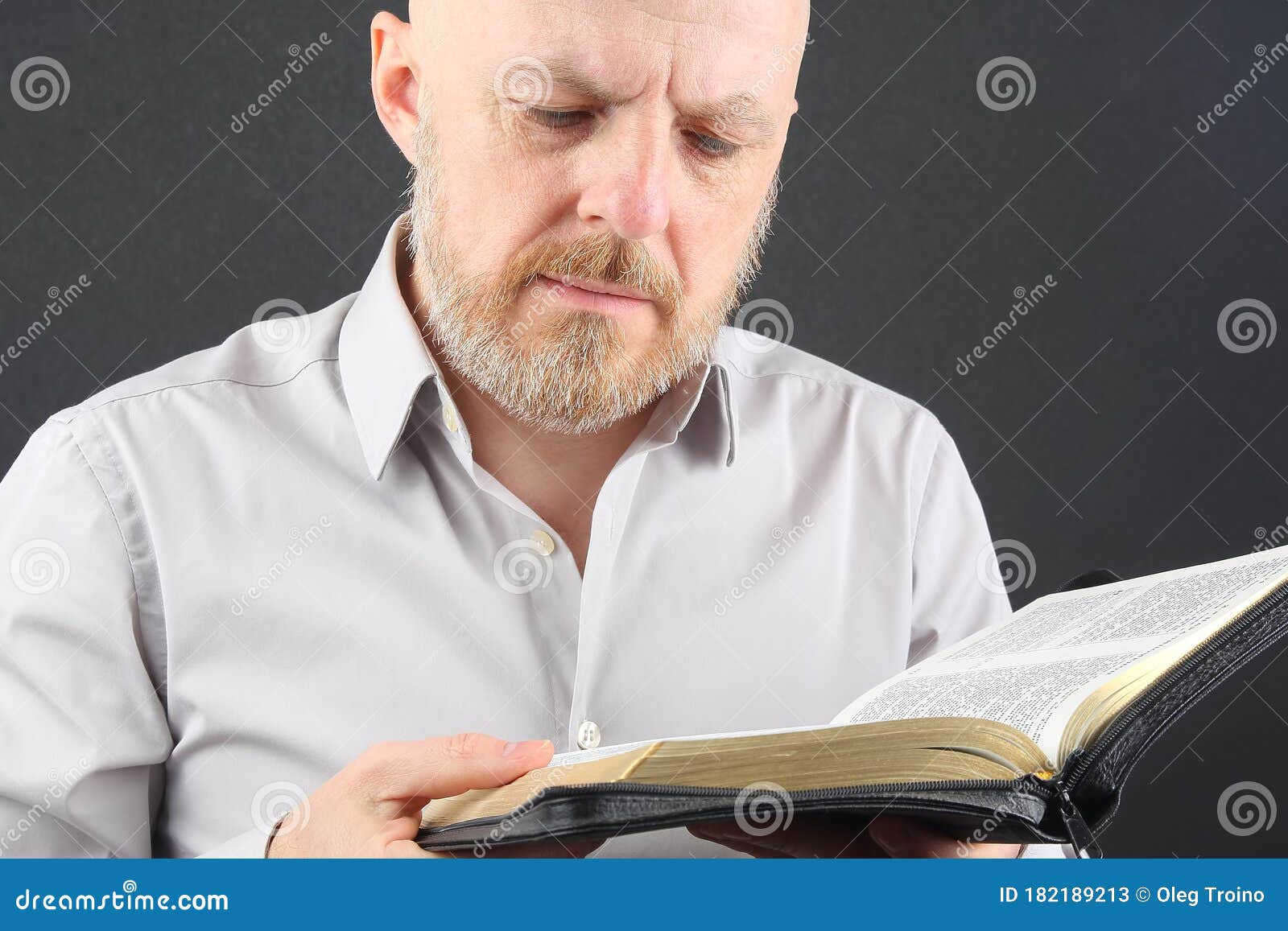 Man Ponders Reading a Bible Book Stock Image - Image of spirituality ...