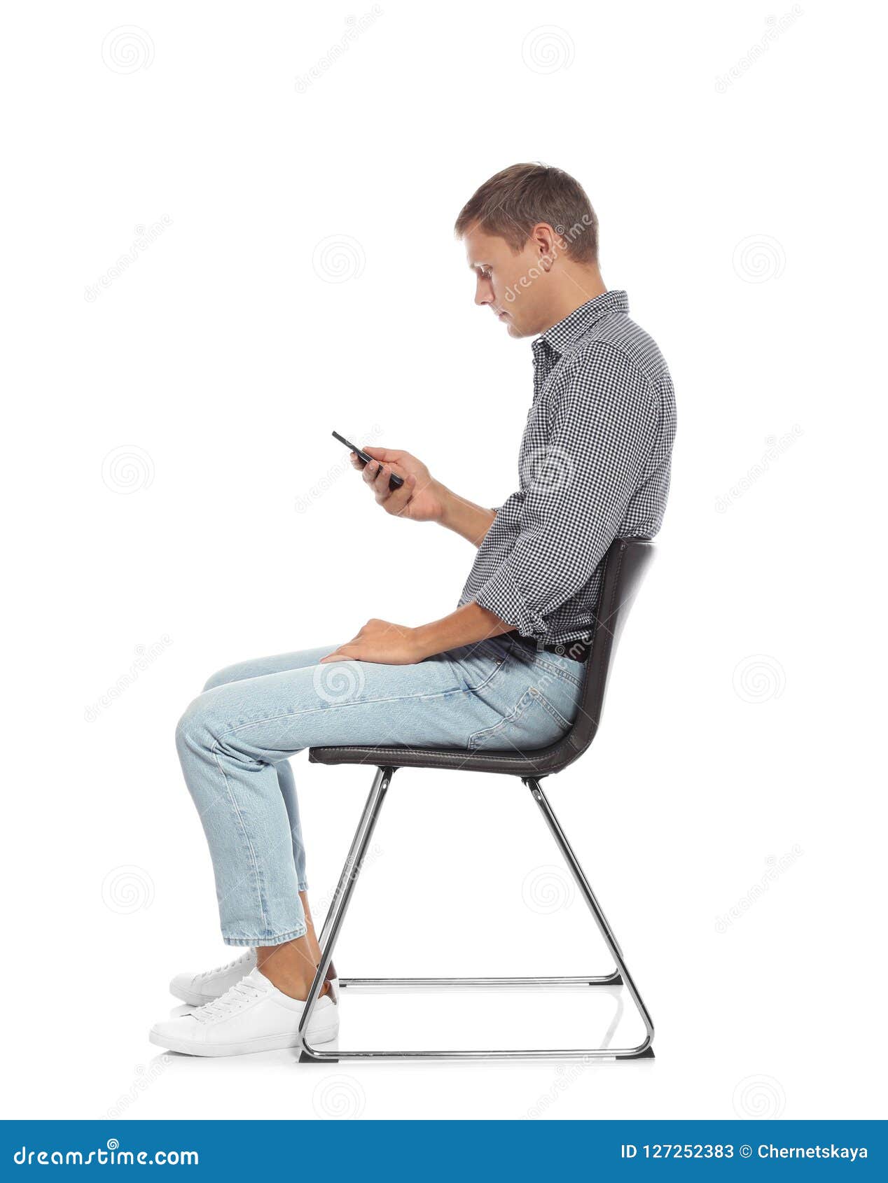 Man with Poor Posture Using Smartphone while Sitting on Chair Stock ...