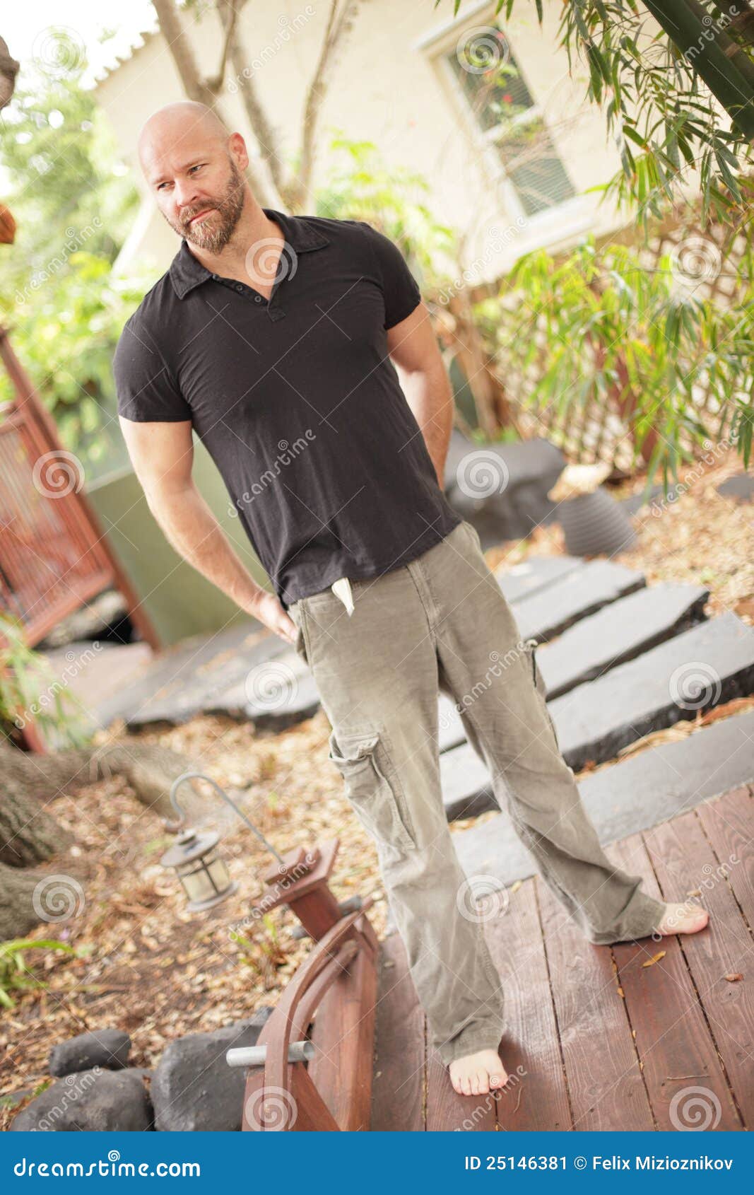 Man Posing Barefoot in the Garden Stock Image - Image of outdoors ...