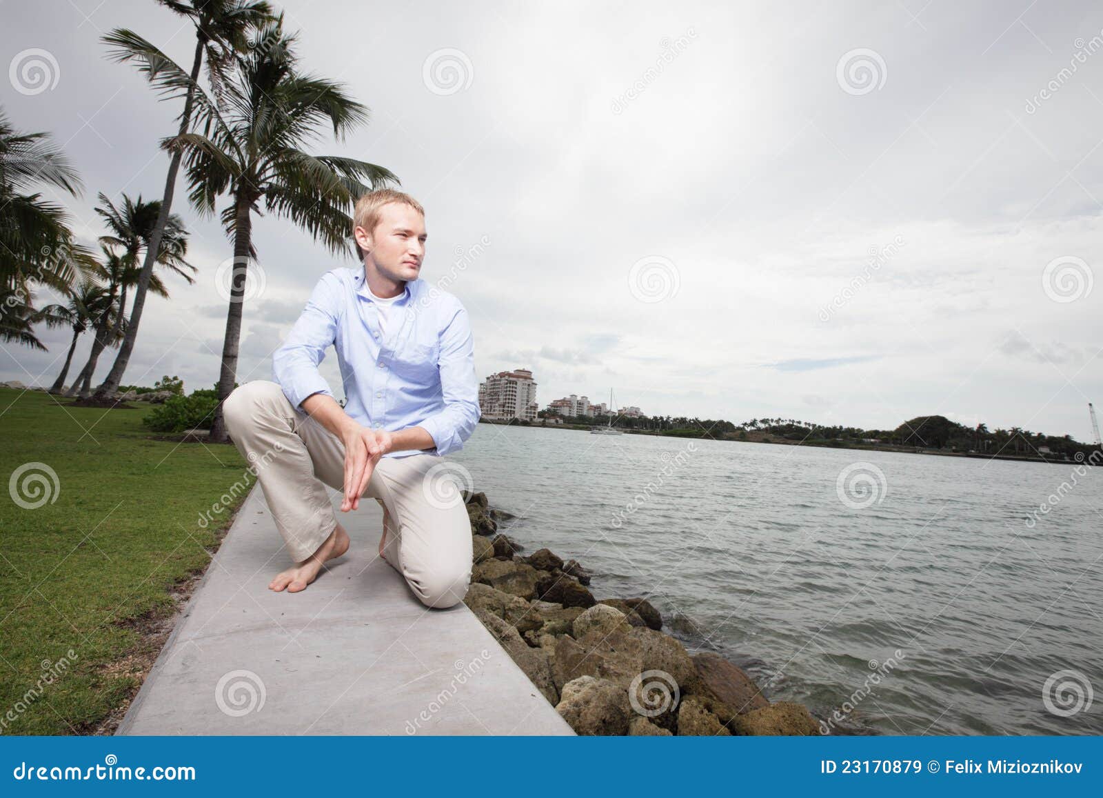 Man Posing by the Bay in Miami Beach Stock Image - Image of shirt ...