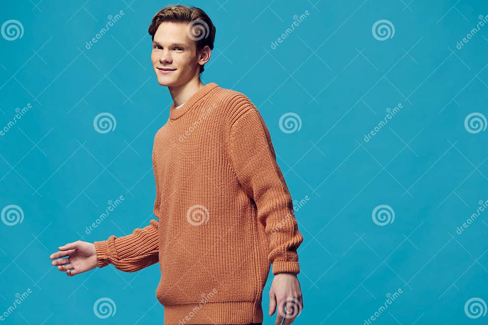 A Man Posing on a Blue Background in a Dynamic Pose with Space for Text ...
