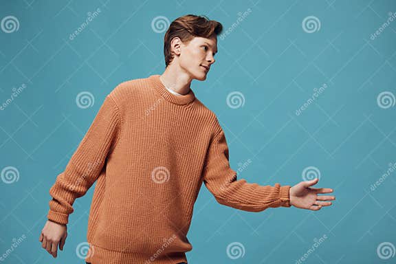 A Man Posing on a Blue Background in a Dynamic Pose with Space for Text ...