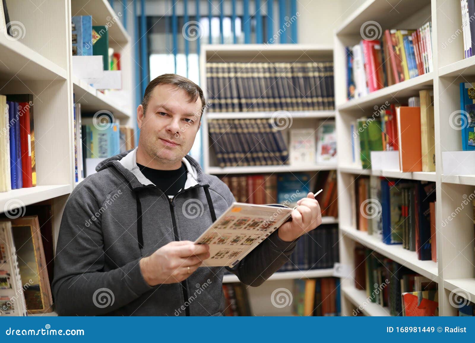 Man posing with book stock image. Image of people, contemplation ...