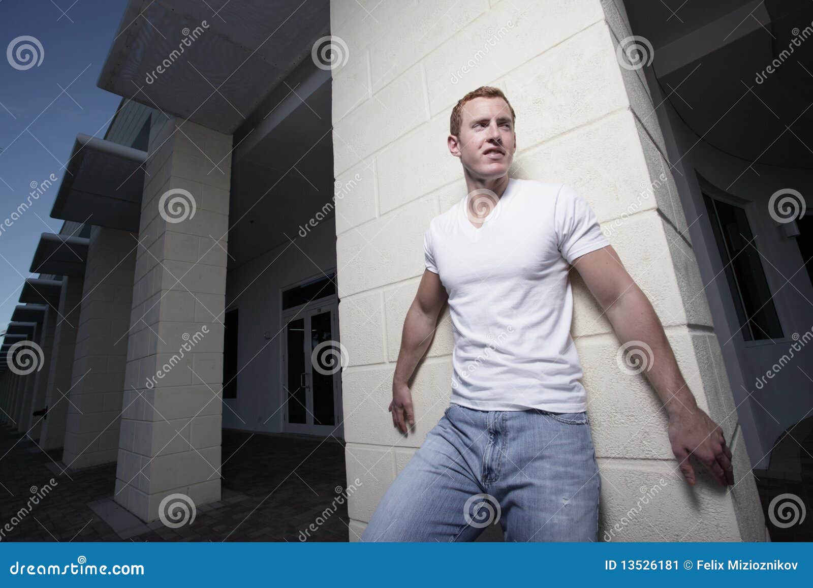 Man posing by a building stock image. Image of white - 13526181