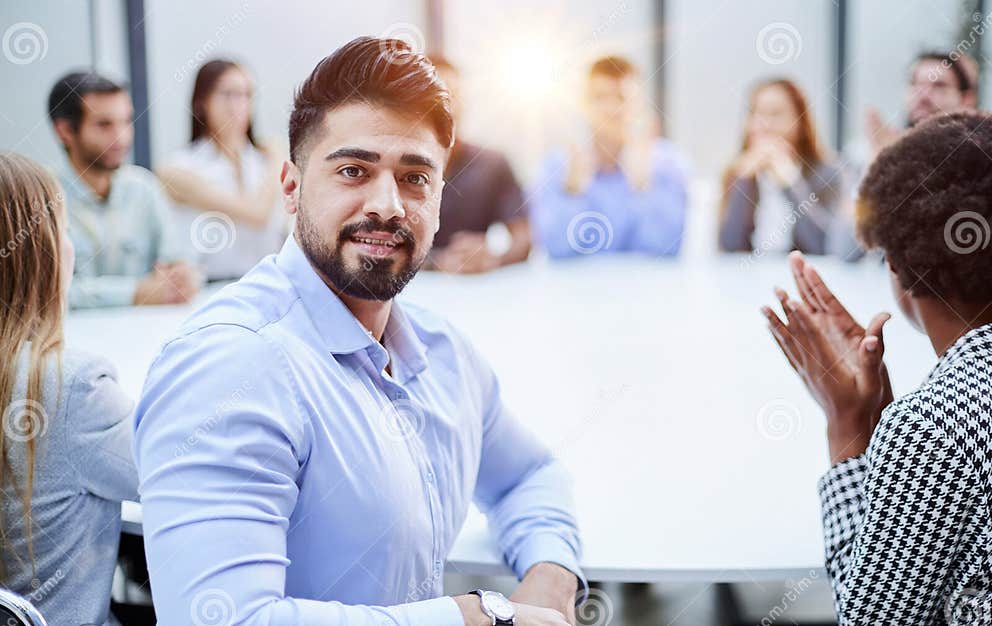 A Man Posing for the Camera while Sitting at a Round Table Stock Image ...