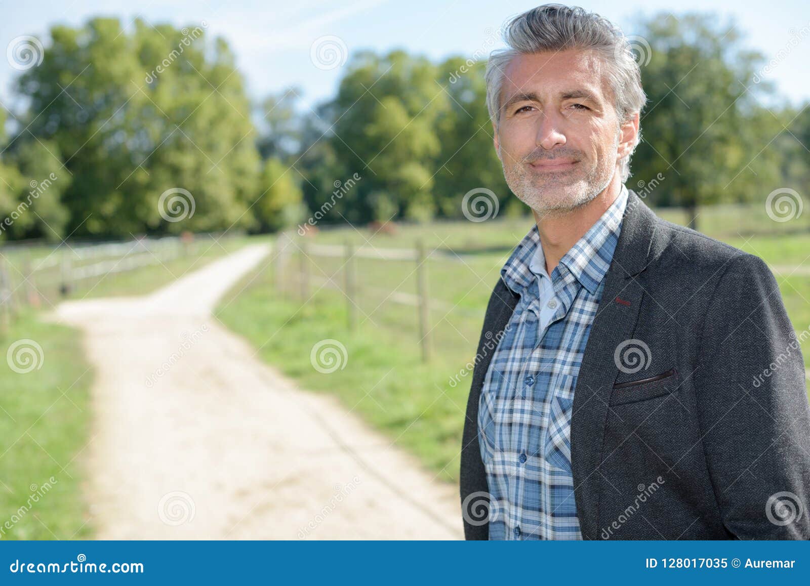 Man posing in country lane stock image. Image of hike - 128017035