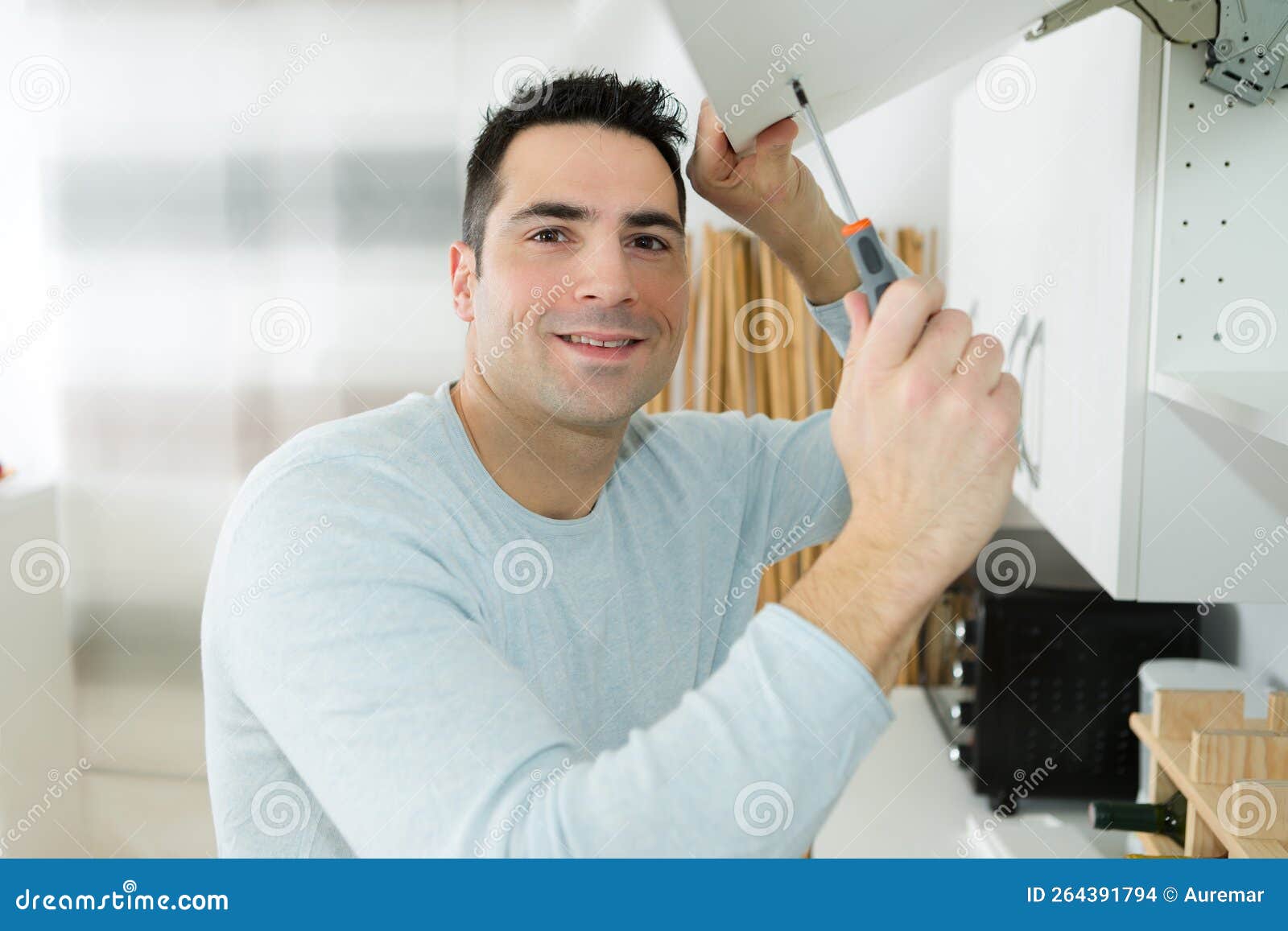Man Posing while Fixing Cupboard Hinges Stock Photo - Image of mounting ...