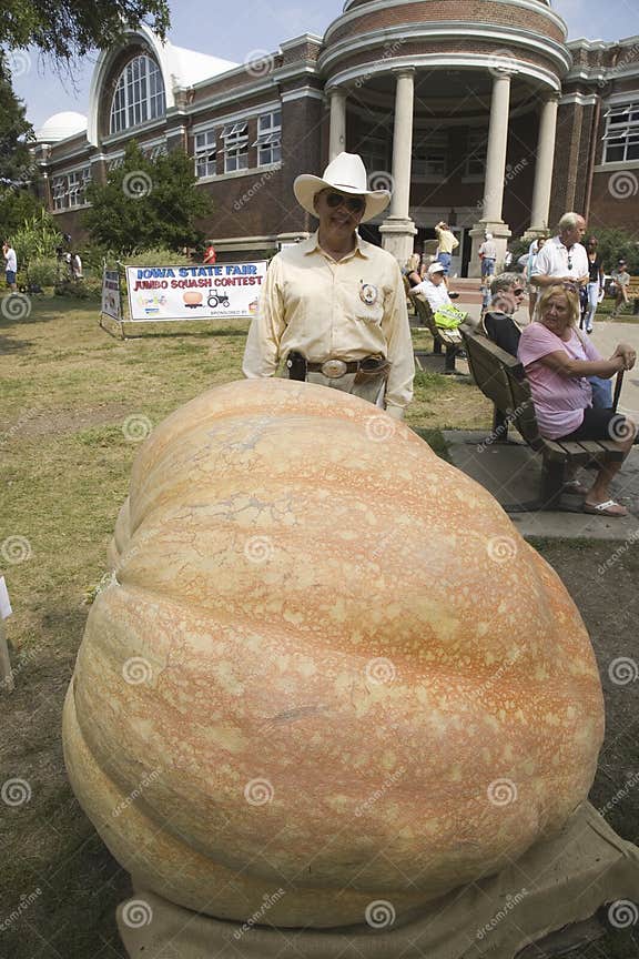 Man Posing in Front of Giant Squash Winner, Editorial Image - Image of ...