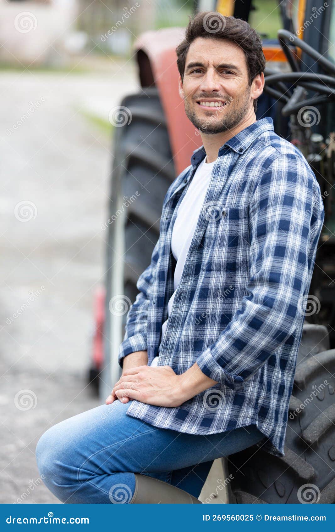 Man posing near tractor stock image. Image of equipment - 269560025