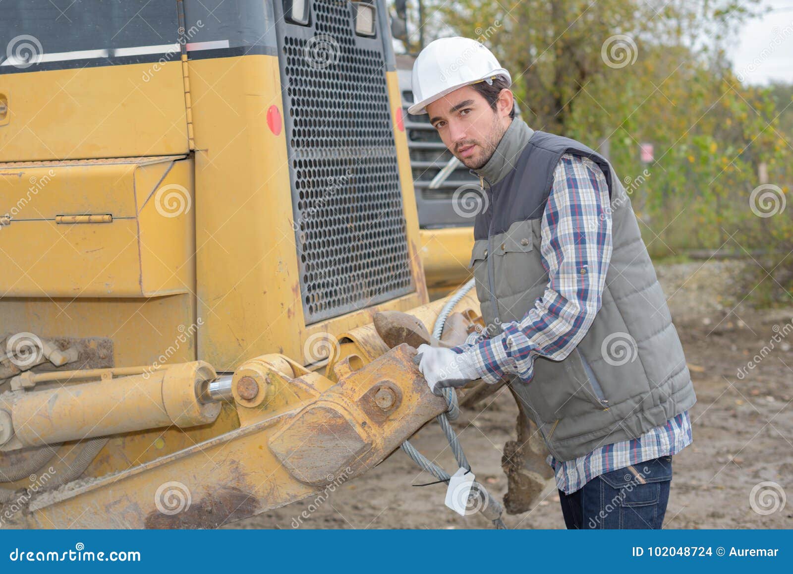 Man Posing Next To Heavy Equipment Stock Photo - Image of modern ...