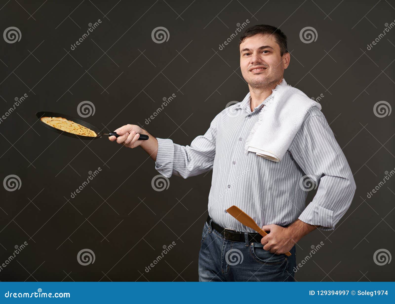 Man Posing with a Pancake in a Pan, White Shirt and Pants, Gray ...