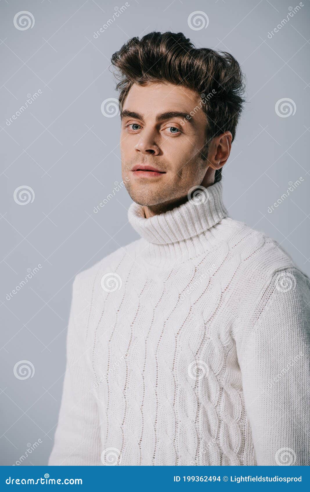 Man Posing in White Knitted Sweater, Isolated on Grey Stock Photo ...