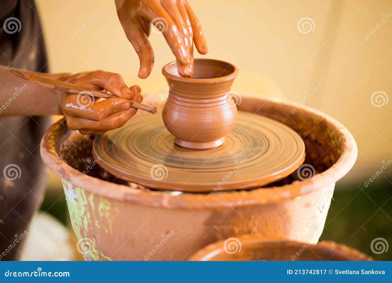 Man Potter Work with Clay Ware. Young Man Potter on His Workshop with ...