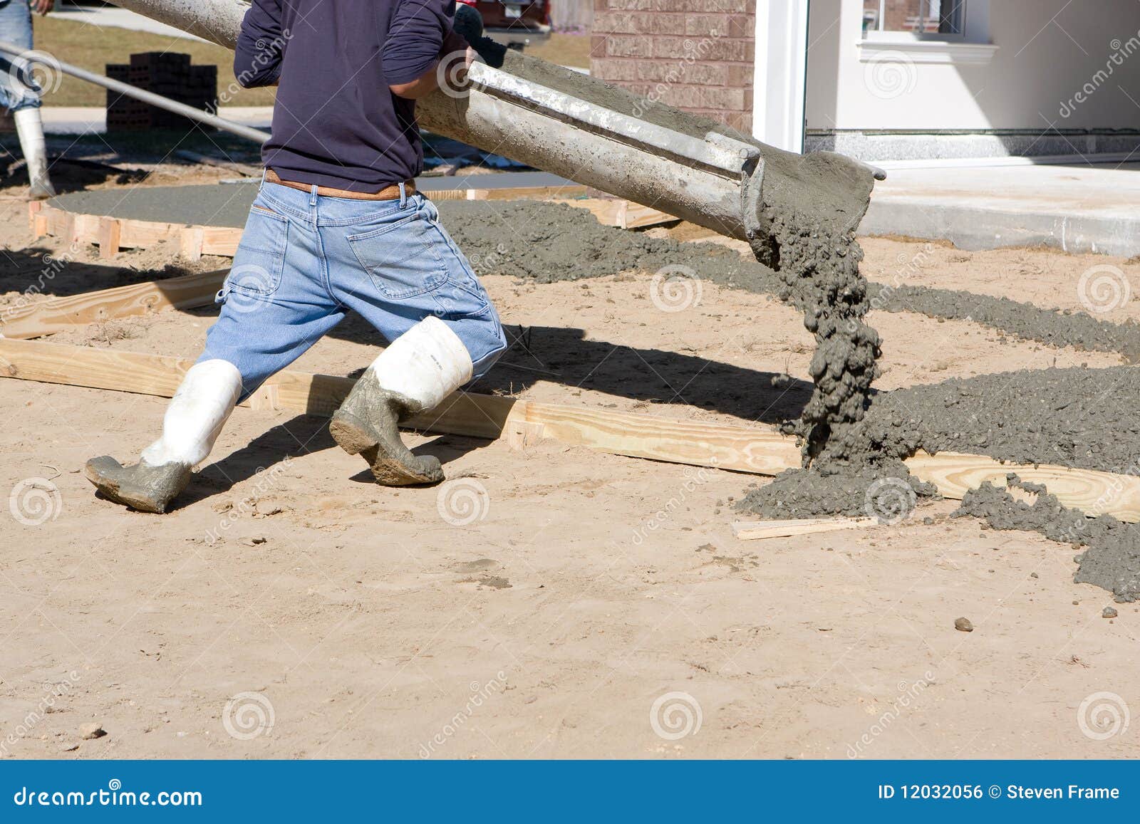 Man Pouring Concrete stock photo. Image of parking, dirt - 12032056