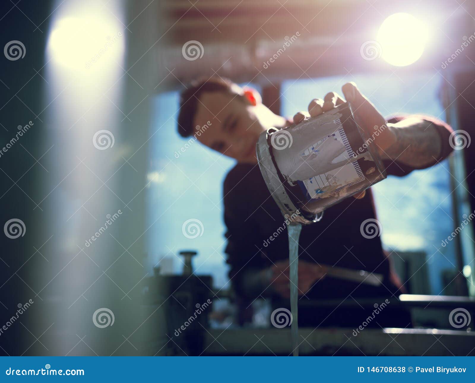 Man Pouring Container with Silver Color in Workshop Stock Photo - Image ...