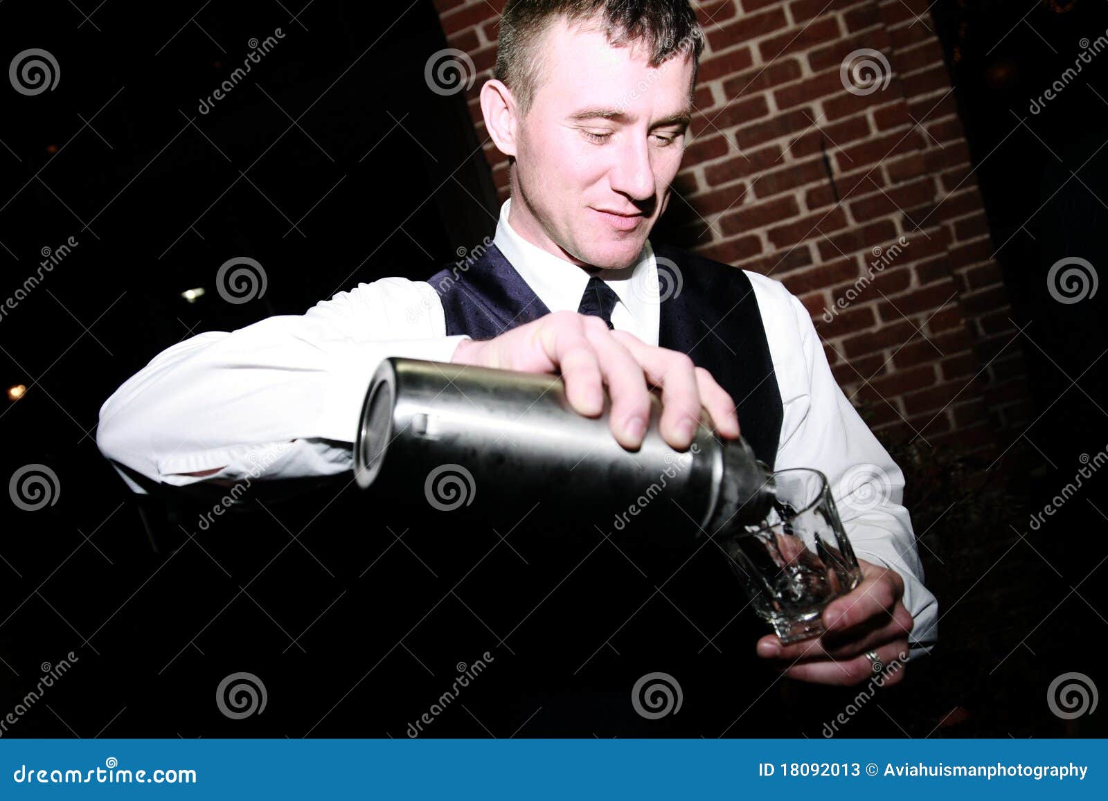 Man Pouring a Drink stock image. Image of handsome, industry - 18092013