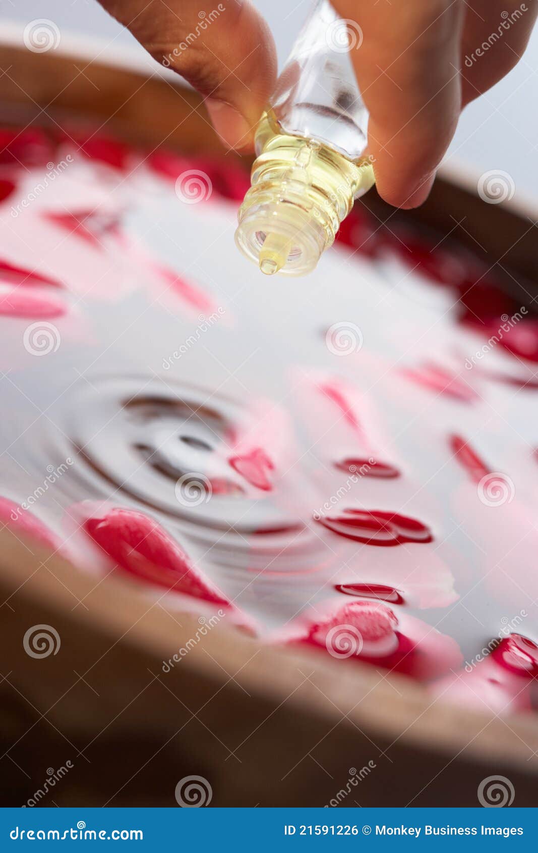 Man Pouring Essential Oil into Water Stock Photo - Image of flower ...