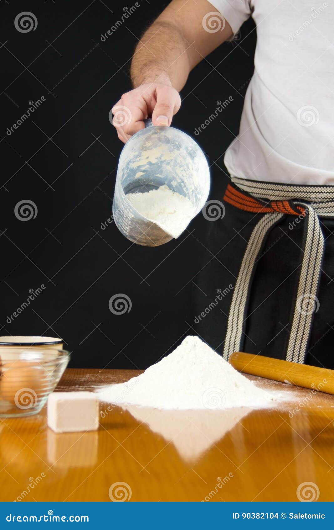 Man Pouring Flour from the Measure Bowl Stock Photo - Image of food ...