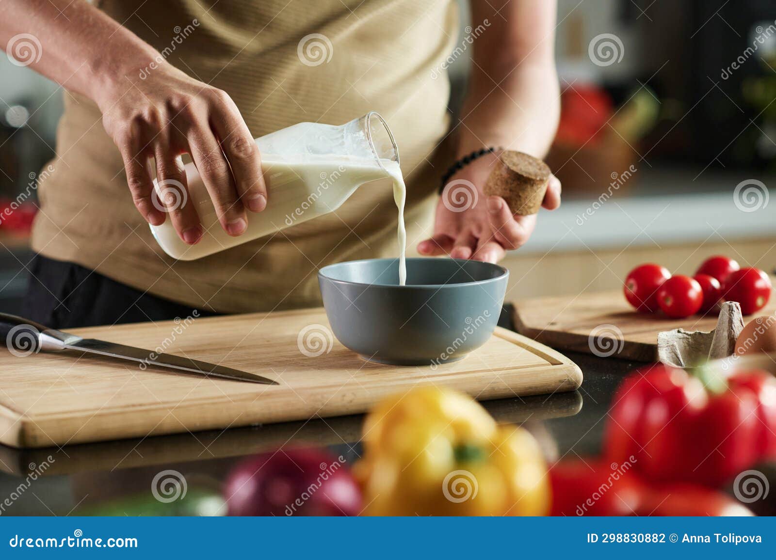 Man Pouring Milk into Bowl stock photo. Image of lifestyle - 298830882