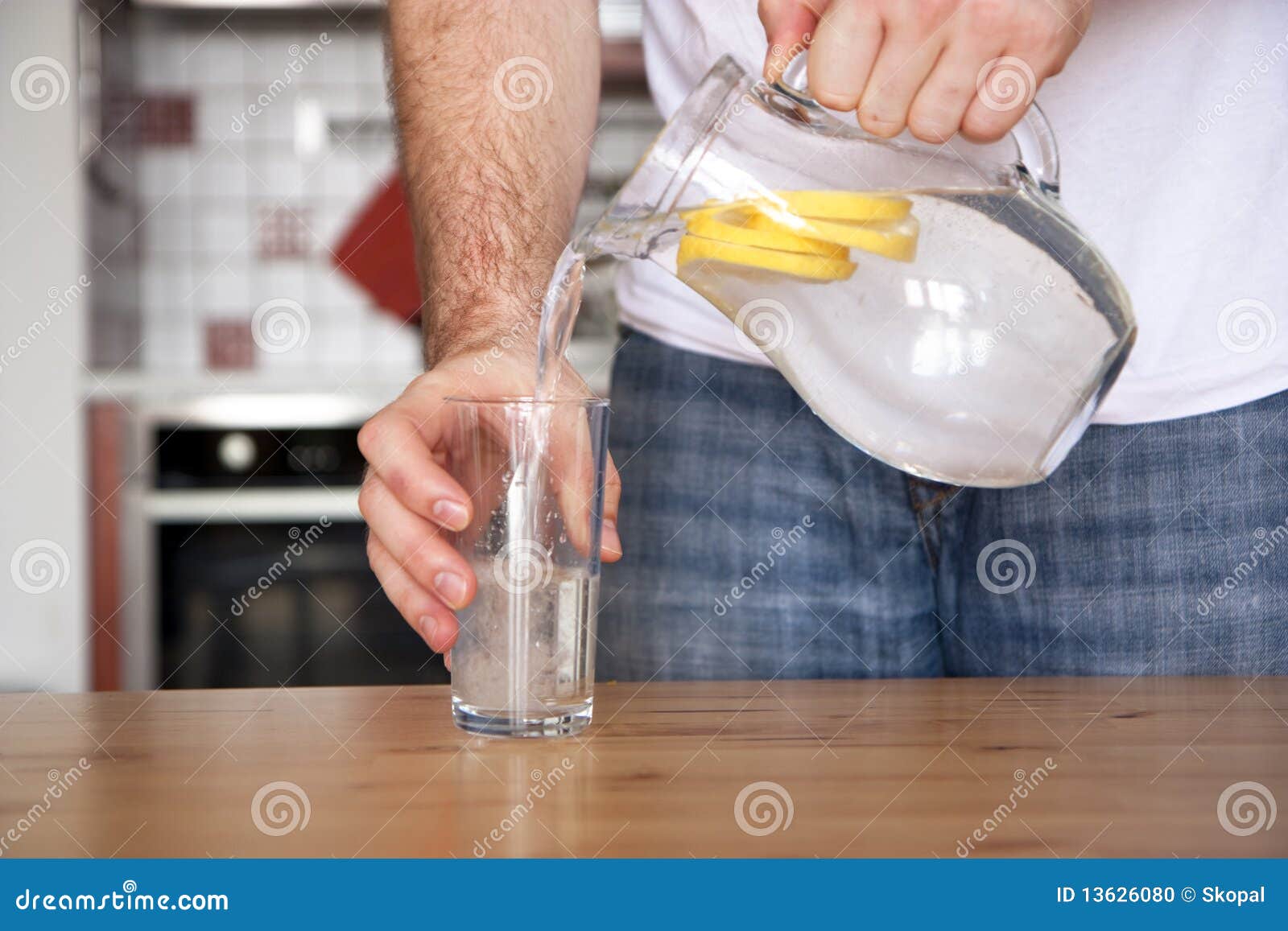 Man pouring out a water stock photo. Image of fruit, glass - 13626080