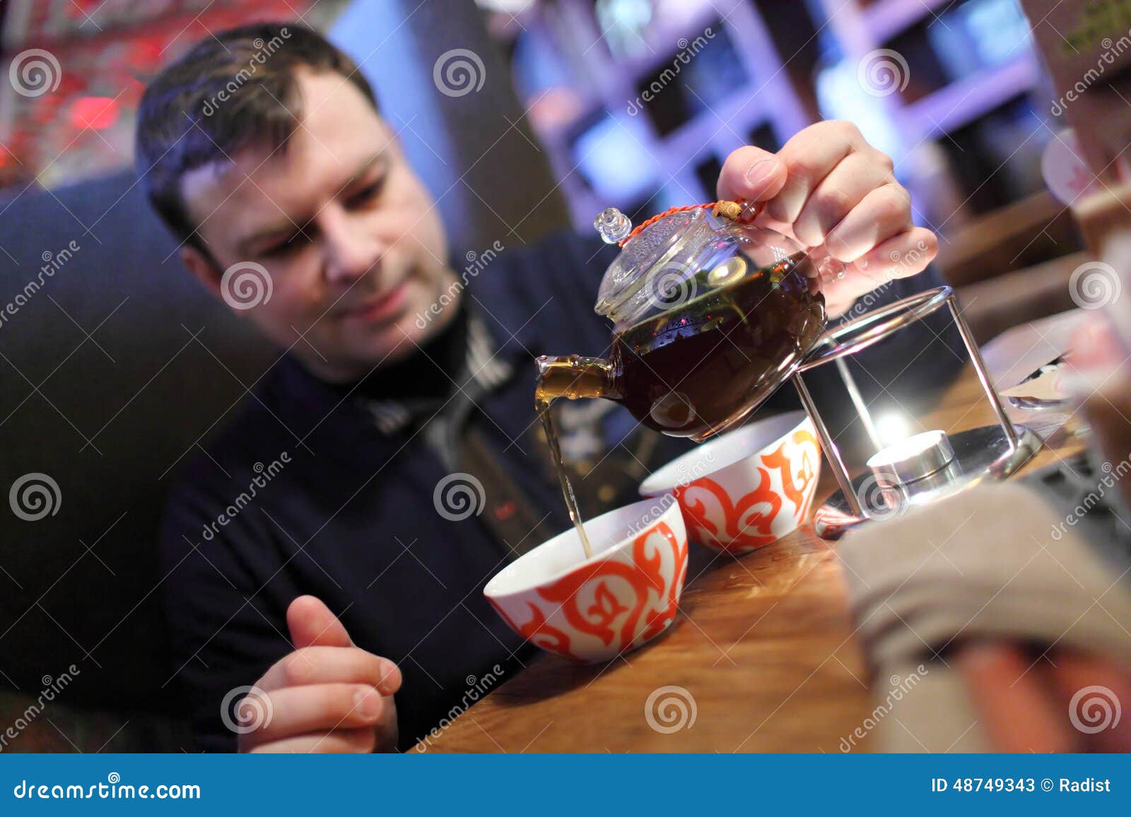 Man pouring tea stock image. Image of person, lifestyle - 48749343