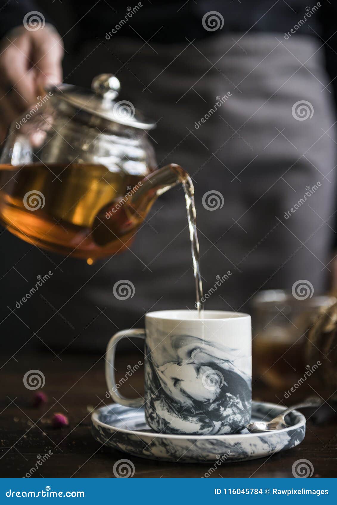 Man pouring tea into a cup stock photo. Image of marry - 116045784