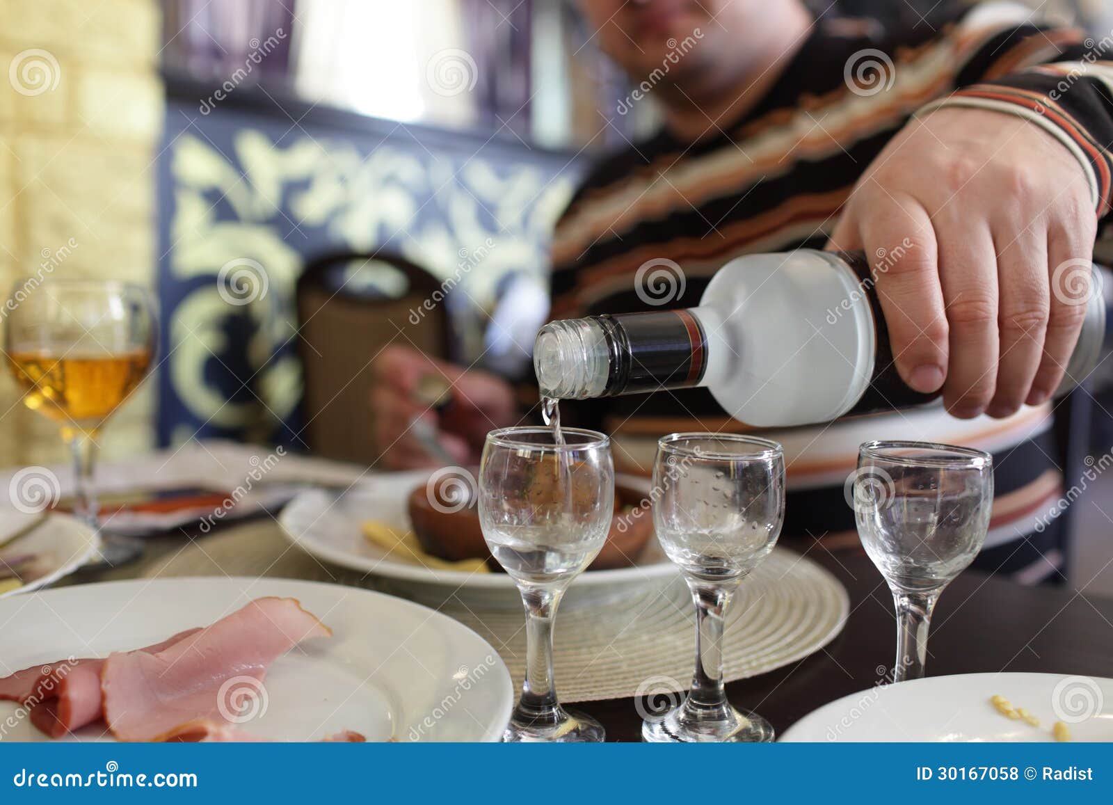 Man Pouring Vodka in Restaurant Stock Photo - Image of celebration ...