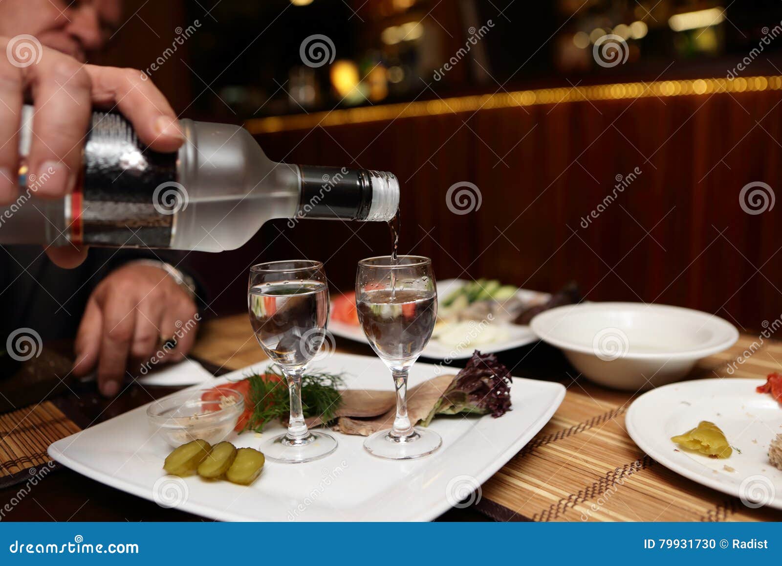 Man pouring vodka stock photo. Image of celebration, cucumber - 79931730