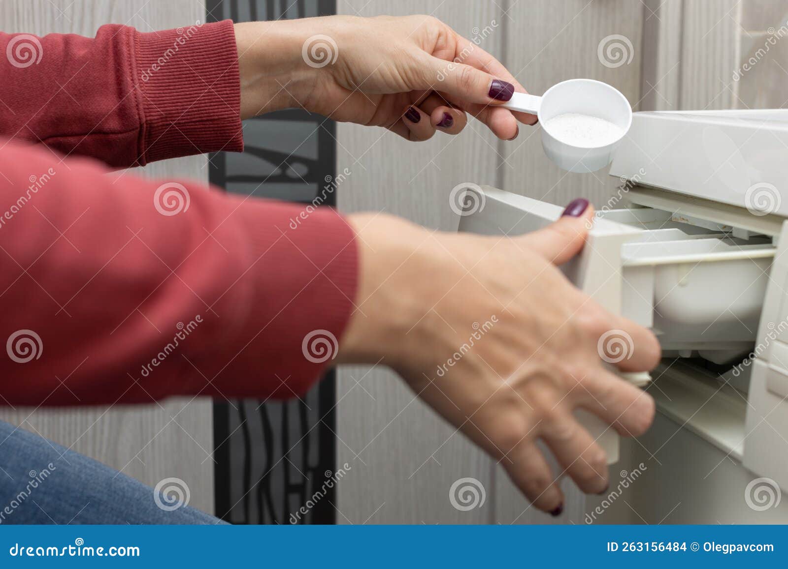 Man Pouring Washing Powder into the Washing Machine. Stock Photo ...