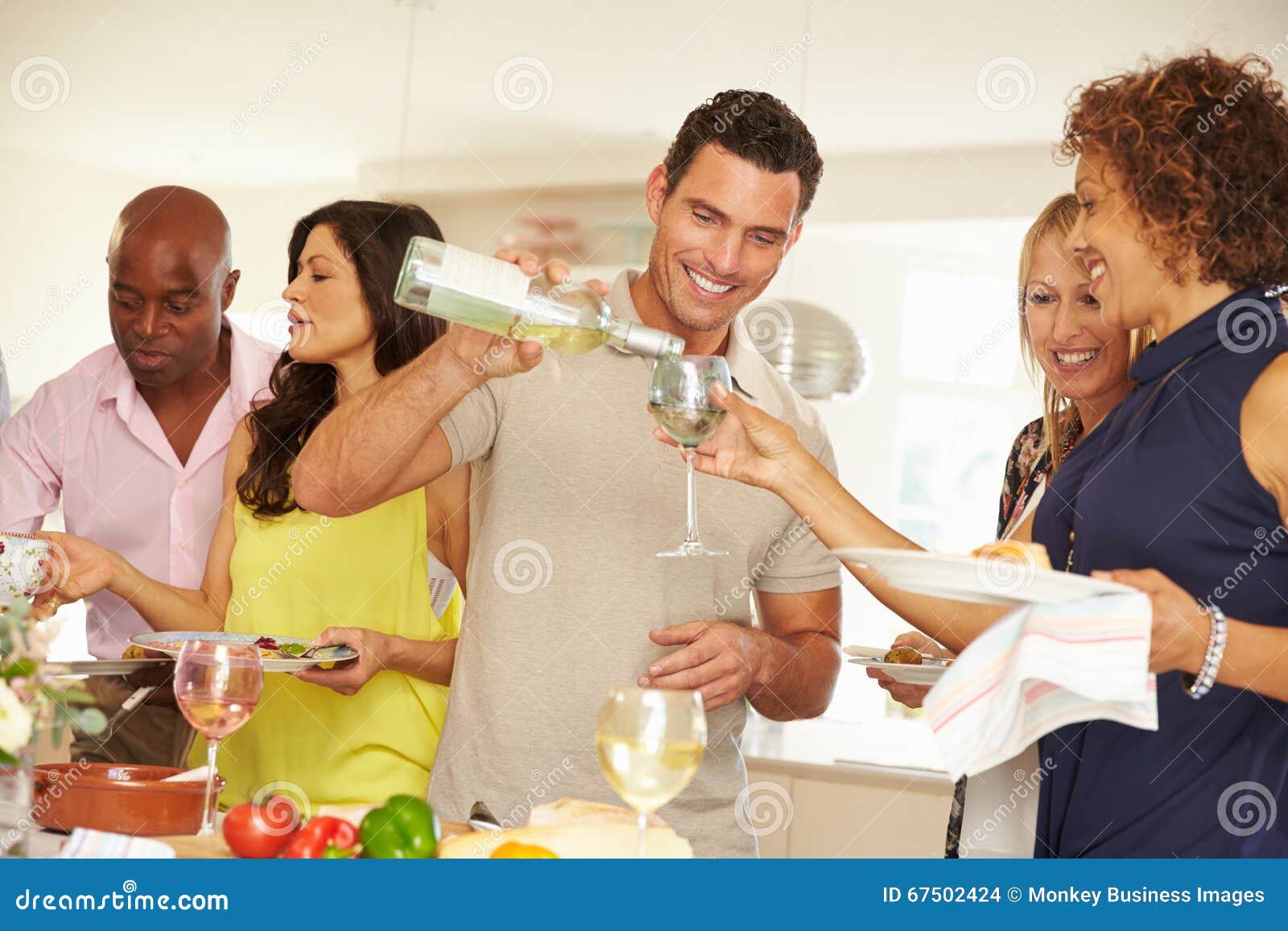 Man Pouring Wine for Guest at Dinner Party Stock Photo - Image of ...