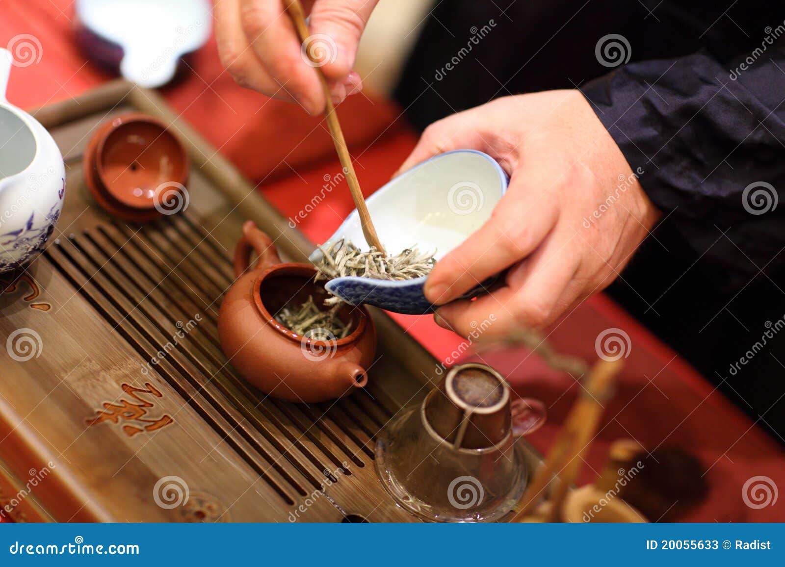 Man Pours Tealeafs into Teapot Stock Image - Image of plate, bamboo ...