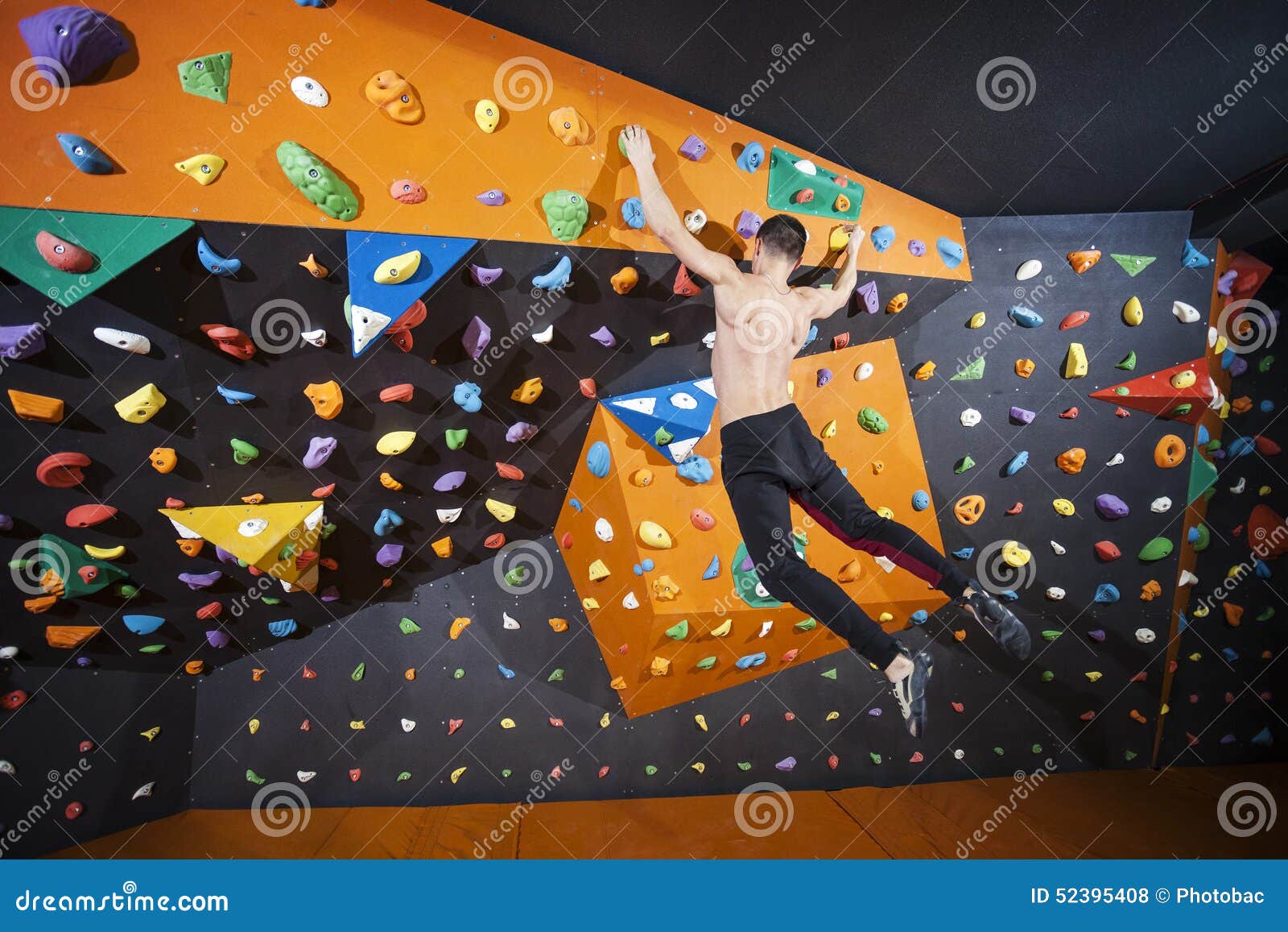 Man Practicing Bouldering in Indoor Climbing Gym Stock Photo - Image of ...
