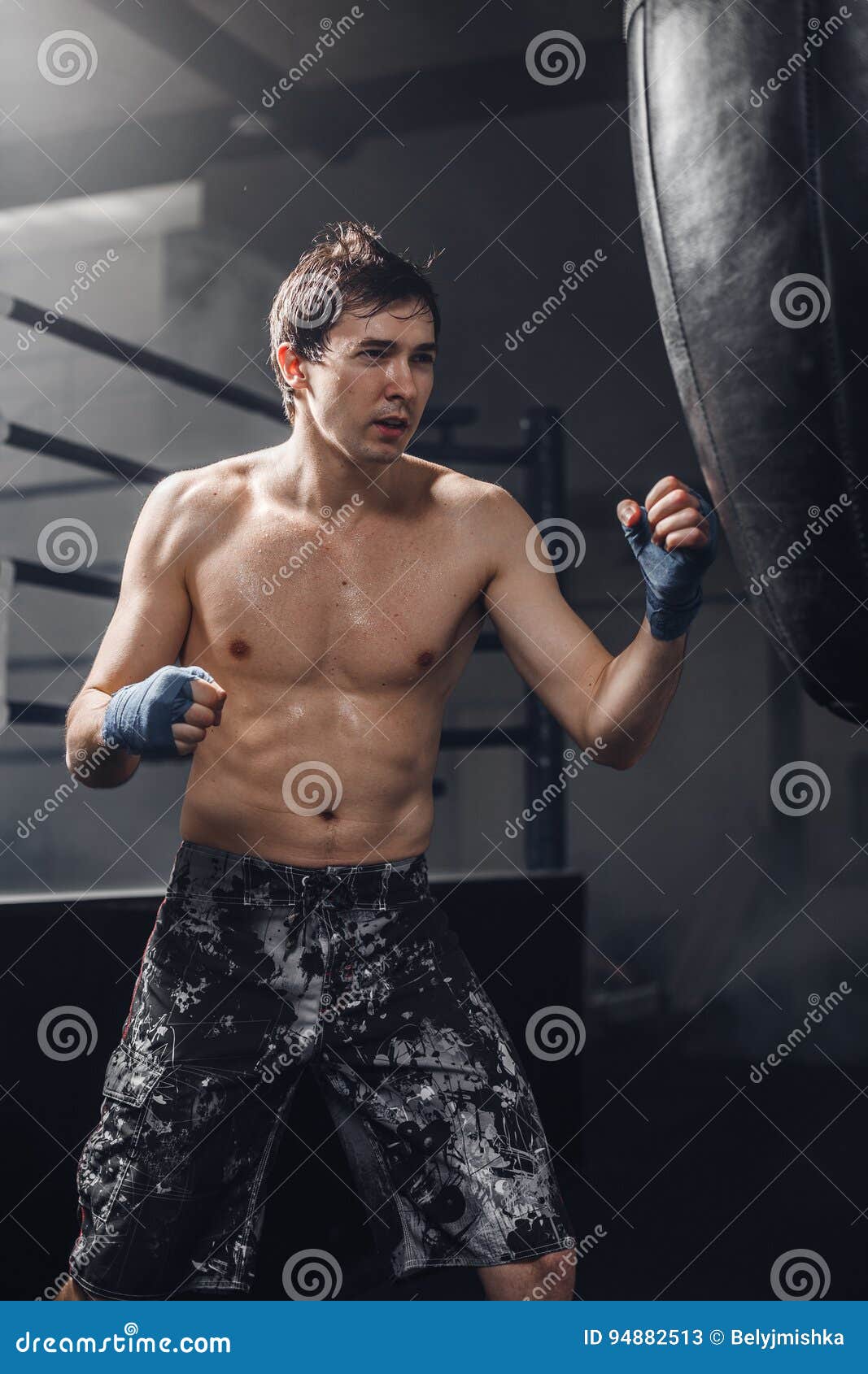 Man Practicing Boxing on Big Black Bag in Gym Stock Image - Image of ...