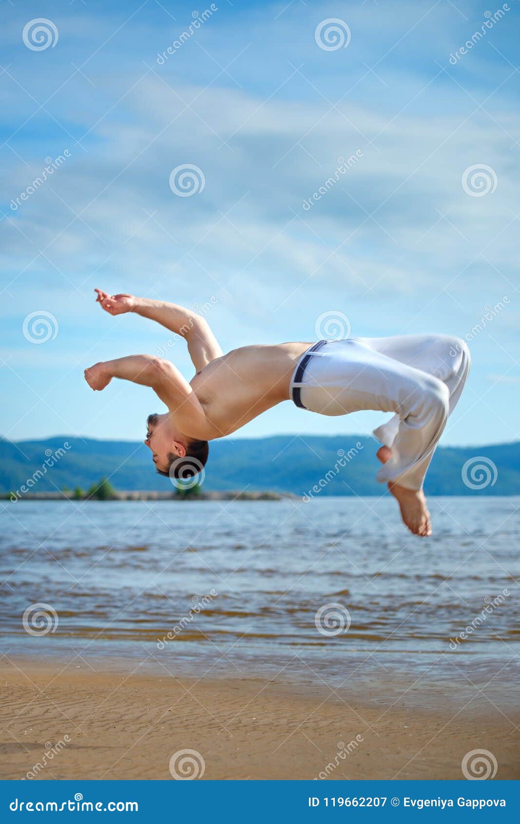 Man Practicing Capoeira on the Beach. the Man Does the Fighting Element ...
