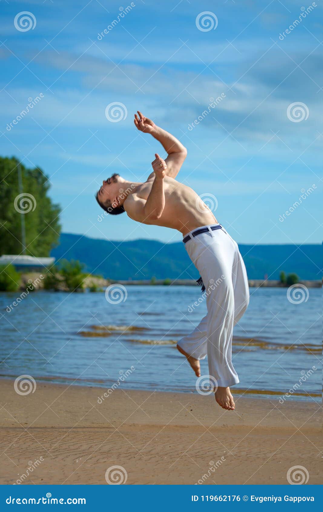 Man Practicing Capoeira on the Beach. the Man Does the Fighting Element ...