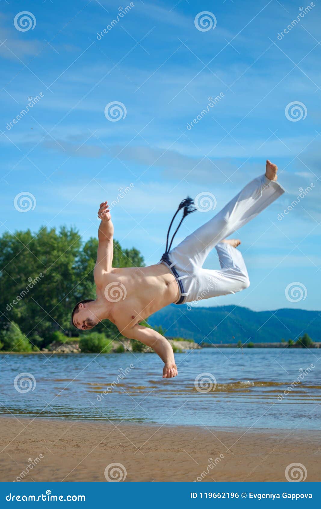Man Practicing Capoeira on the Beach. the Man Does the Fighting Element ...