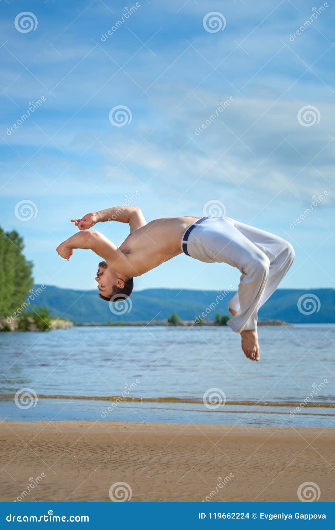 Man Practicing Capoeira on the Beach. the Man Does the Fighting Element ...