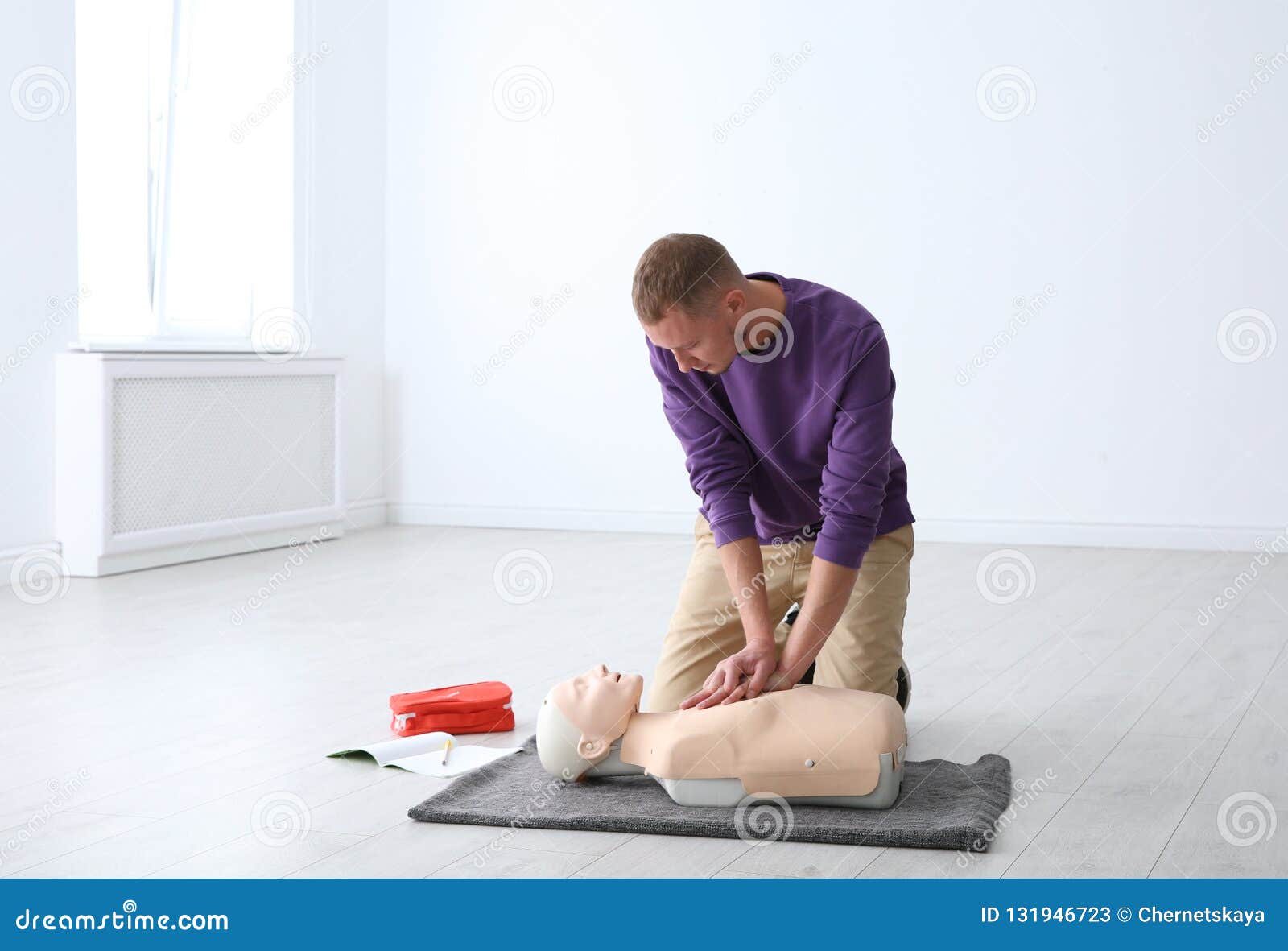 Man Practicing First Aid on Mannequin Stock Image - Image of background ...