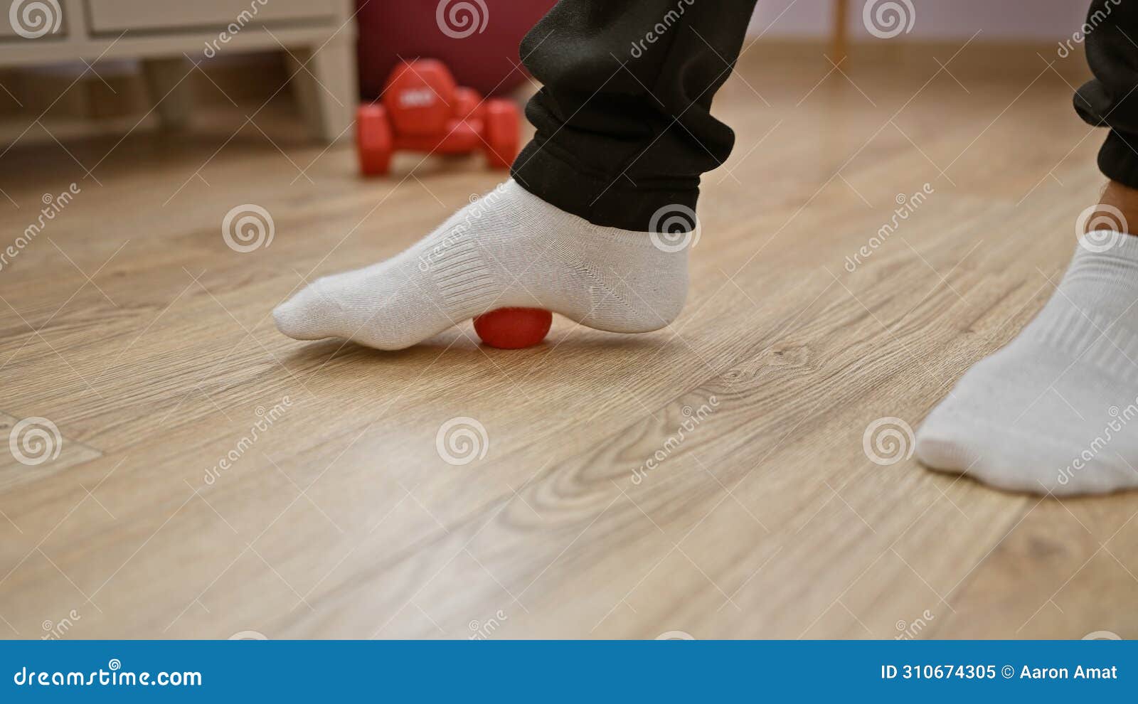 Man Practicing Foot Exercise with Red Ball in Rehabilitation Clinic ...