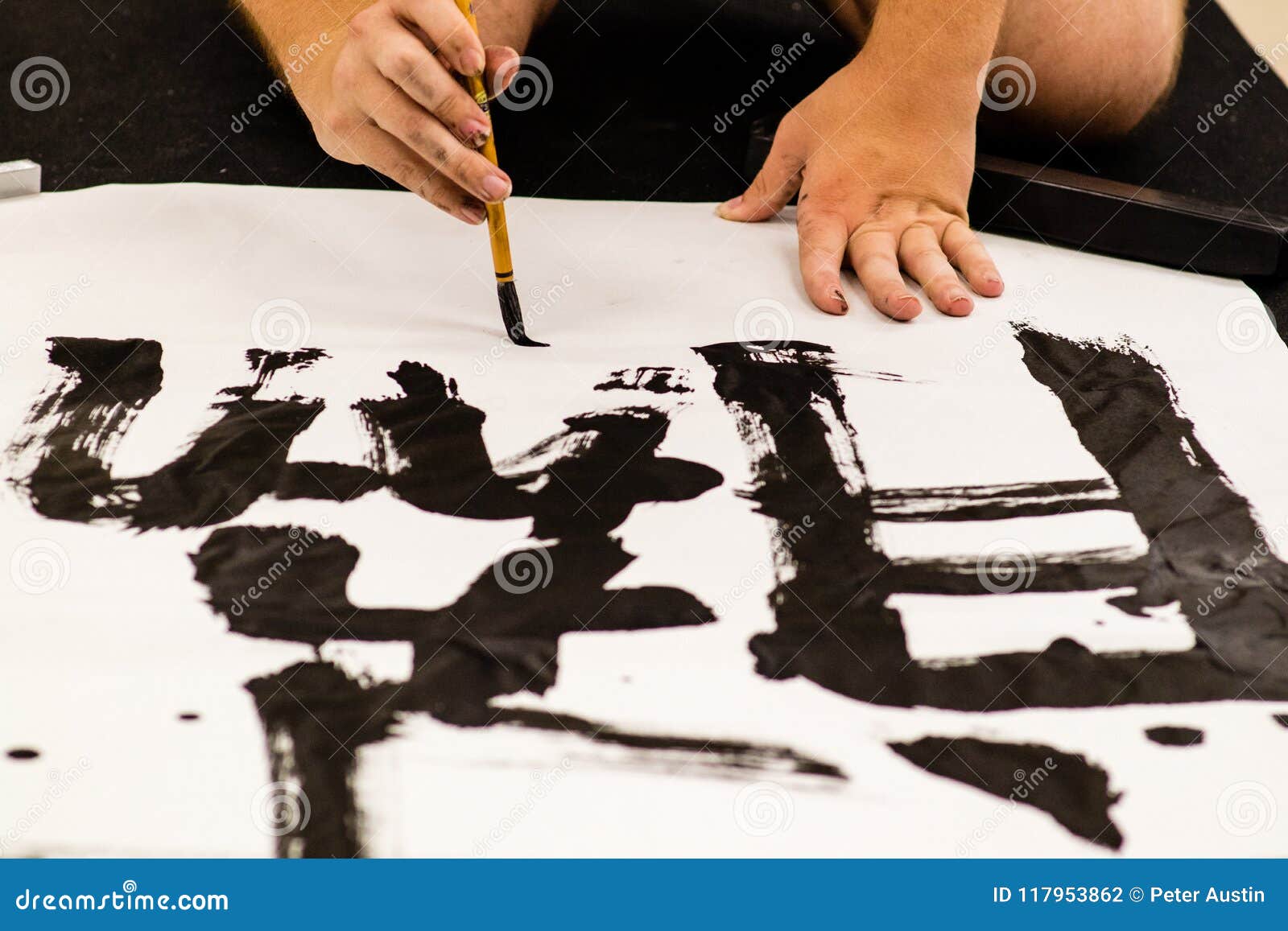 A Man Practicing Japanese Calligraphy Stock Photo - Image of ...